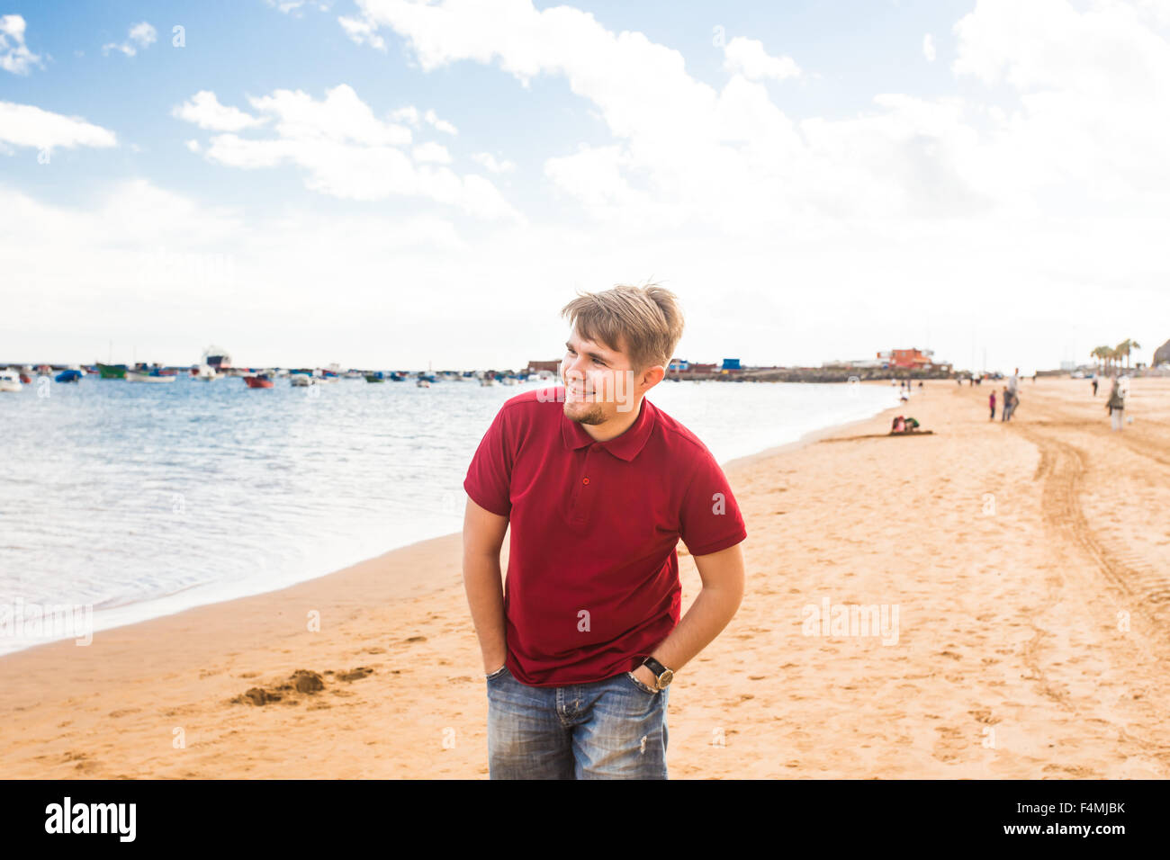 Smiling man at the beach Stock Photo - Alamy