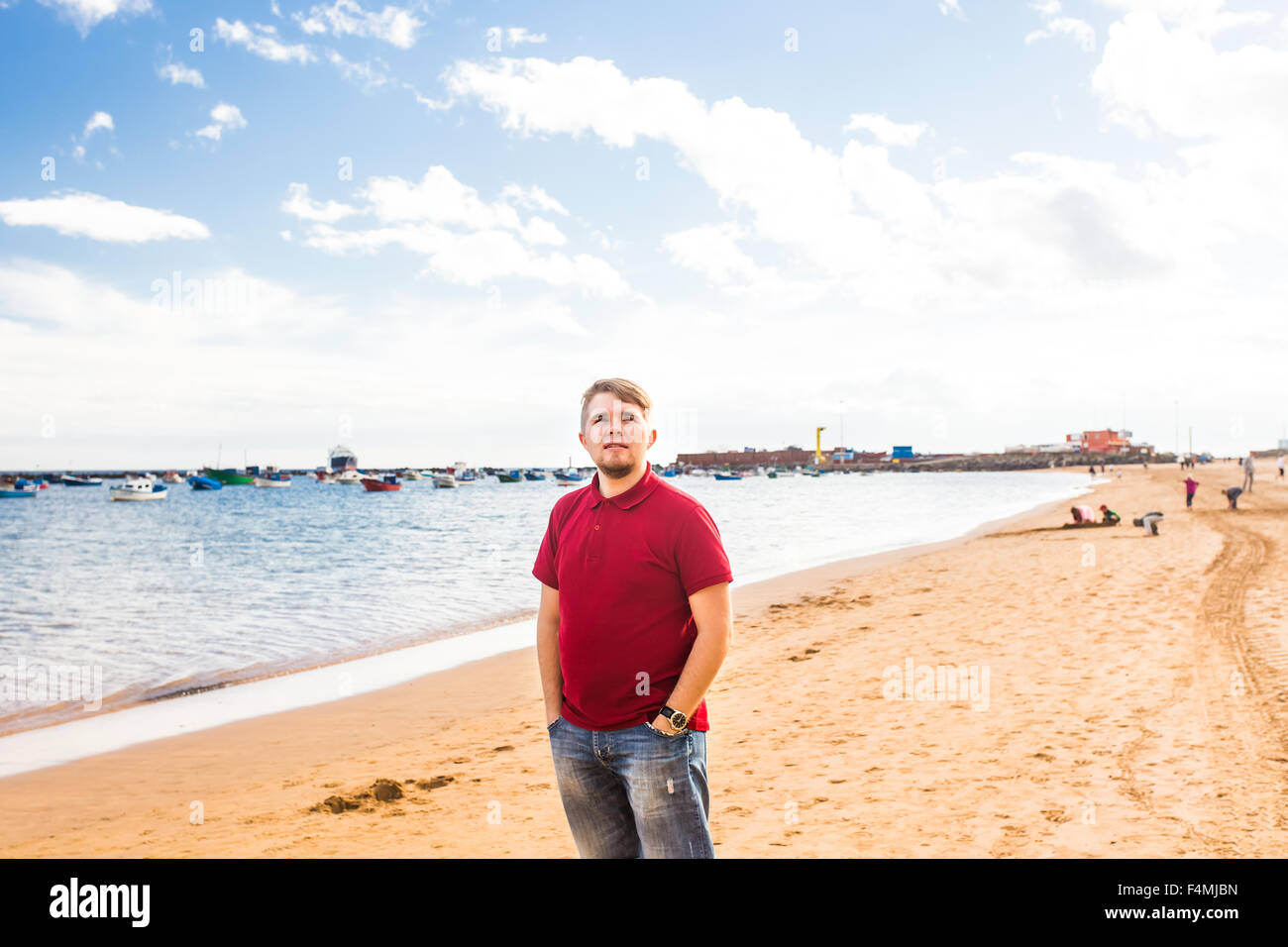 Smiling man at the beach Stock Photo - Alamy