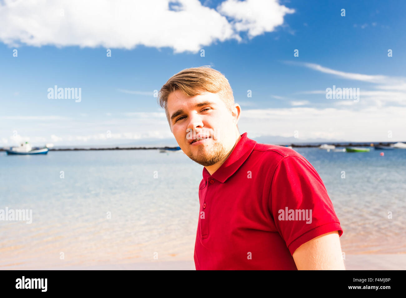 Smiling man at the beach Stock Photo - Alamy