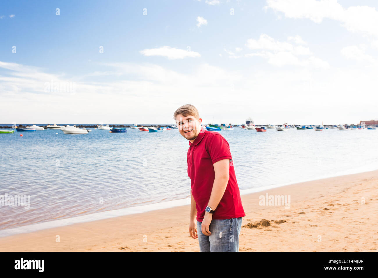 Smiling man at the beach Stock Photo - Alamy