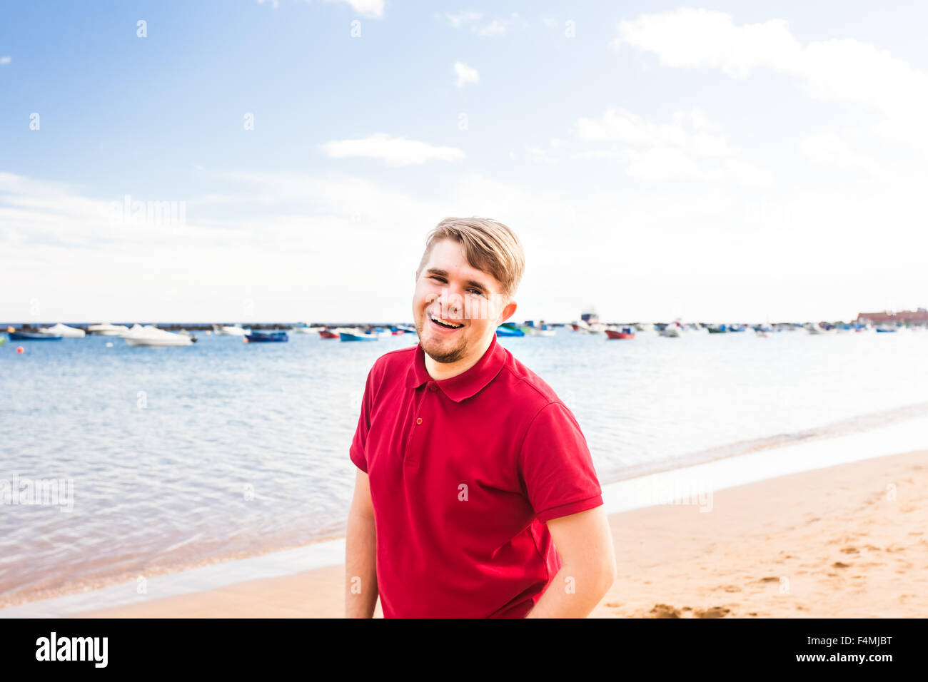 Smiling man at the beach Stock Photo - Alamy