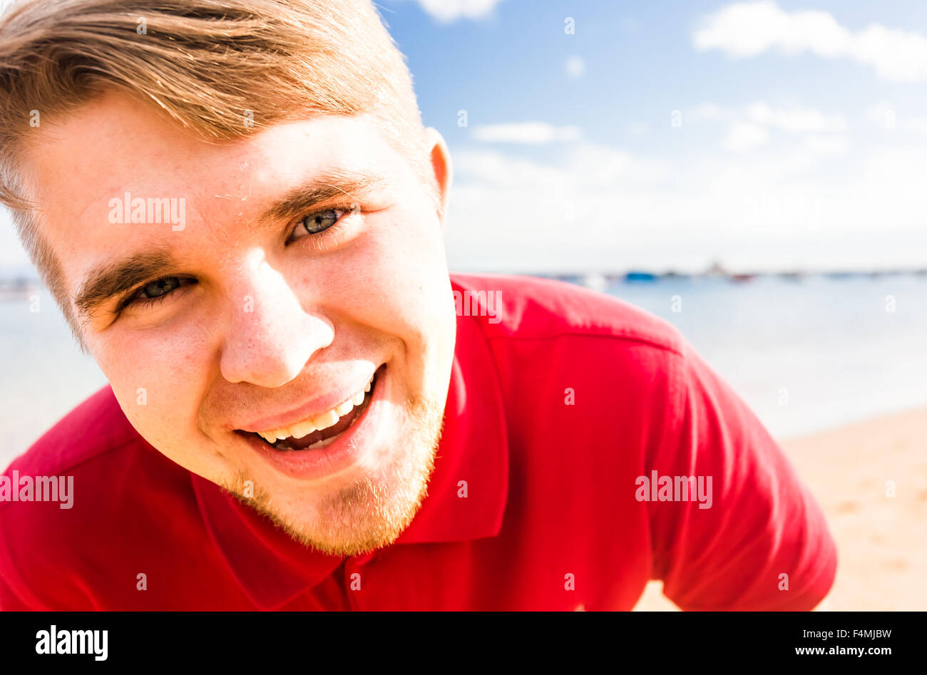 Smiling man at the beach Stock Photo - Alamy