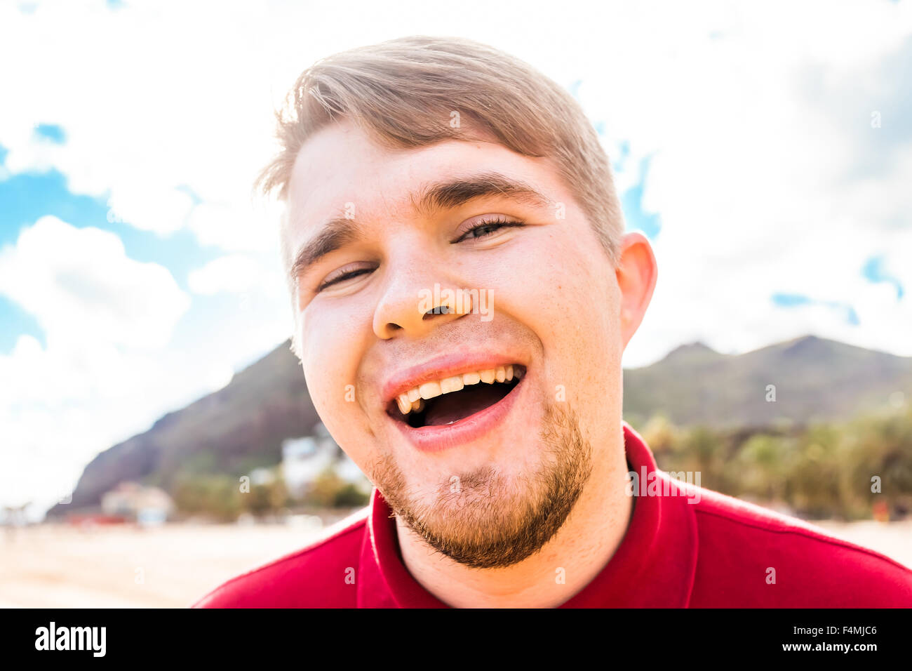 Smiling man at the beach Stock Photo - Alamy