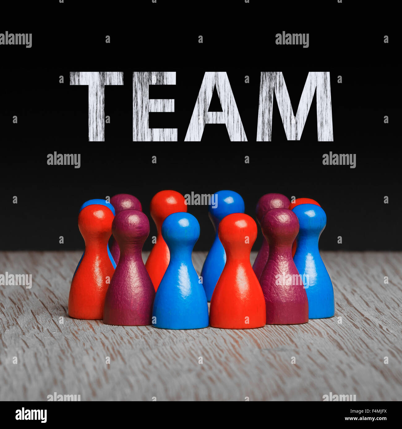 Concept for team, teamwork with chalk white text. Red blue purple pawn ...