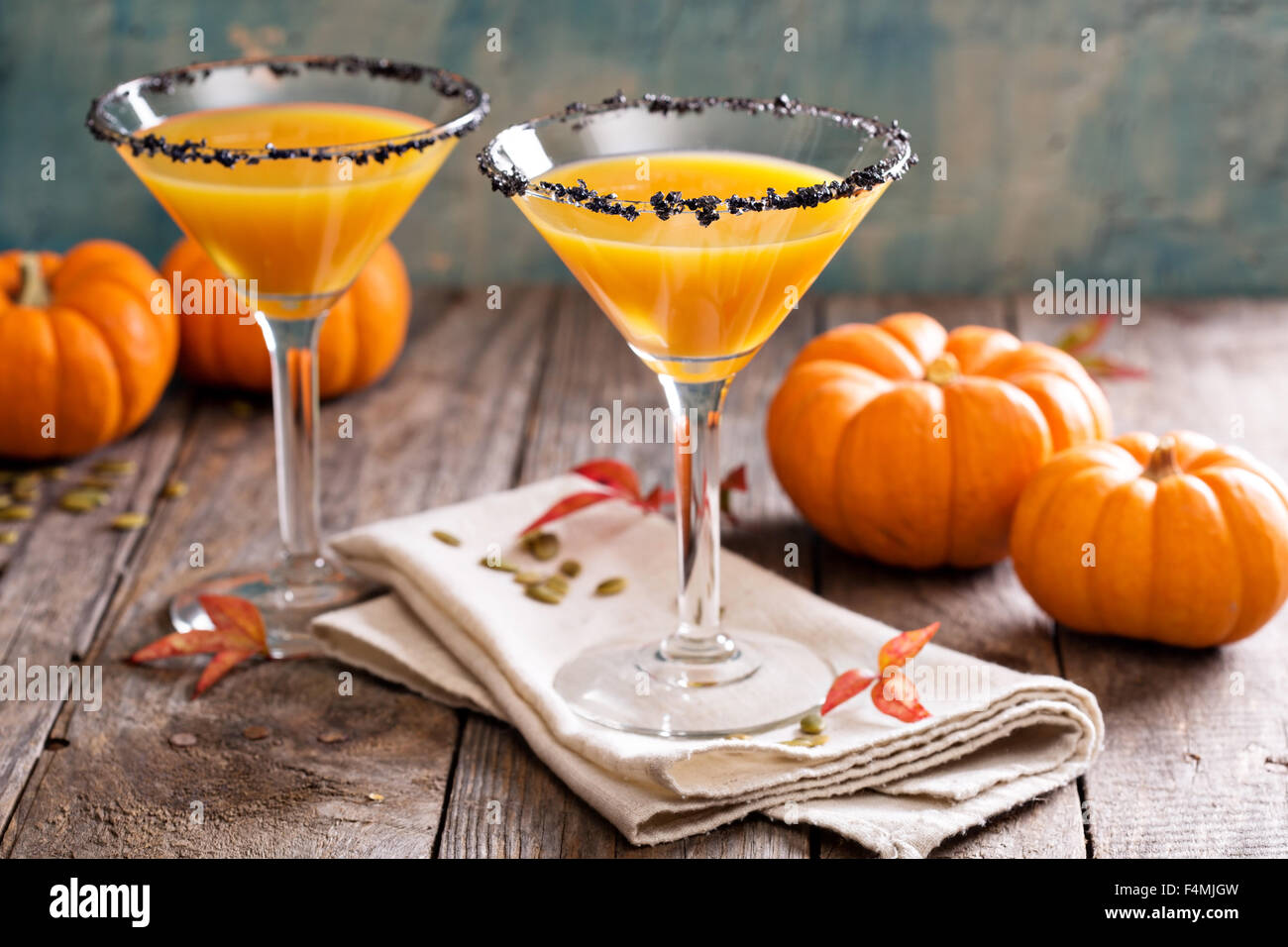Pumpkintini pumpkin martini coctail with black salt rim for fall and ...