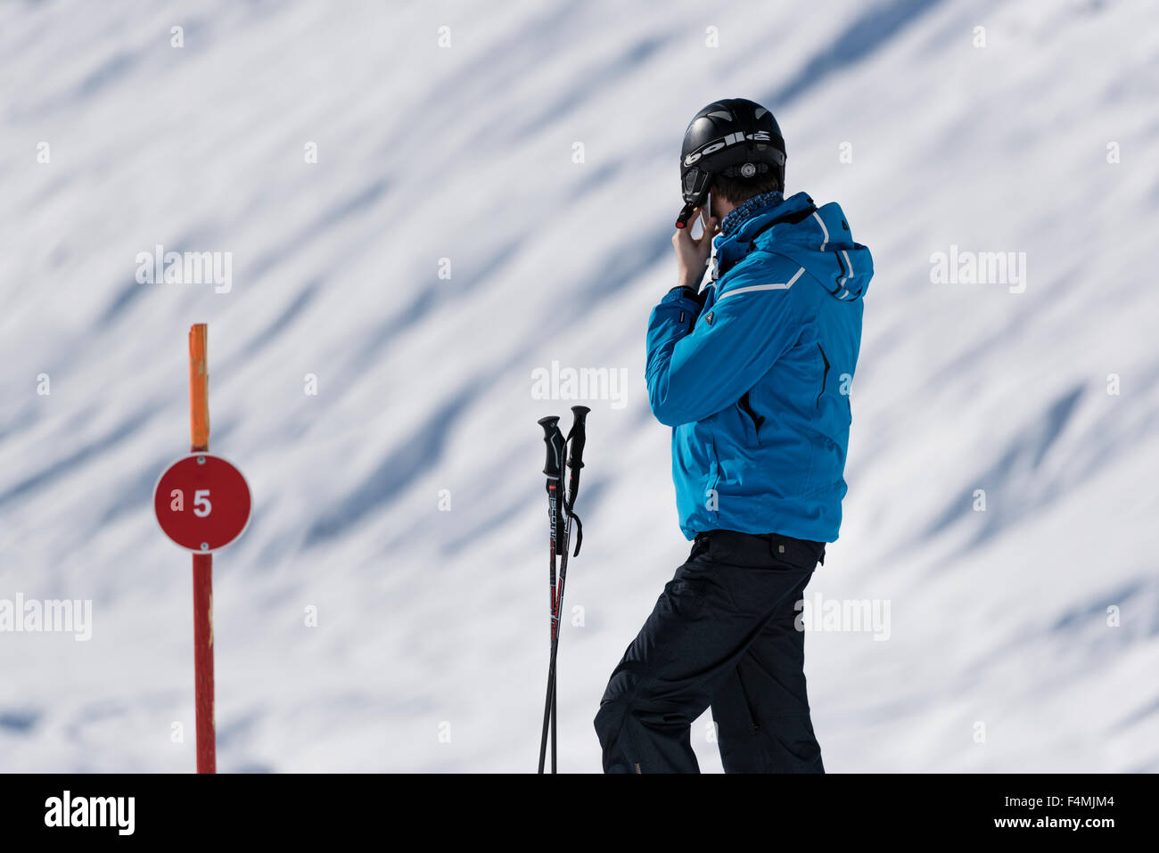 Skier talking on mobile phone hi-res stock photography and images - Alamy