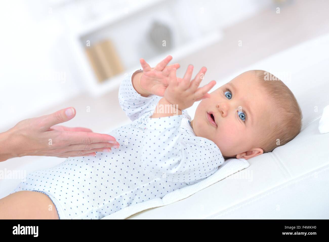 Baby lying on back Stock Photo - Alamy