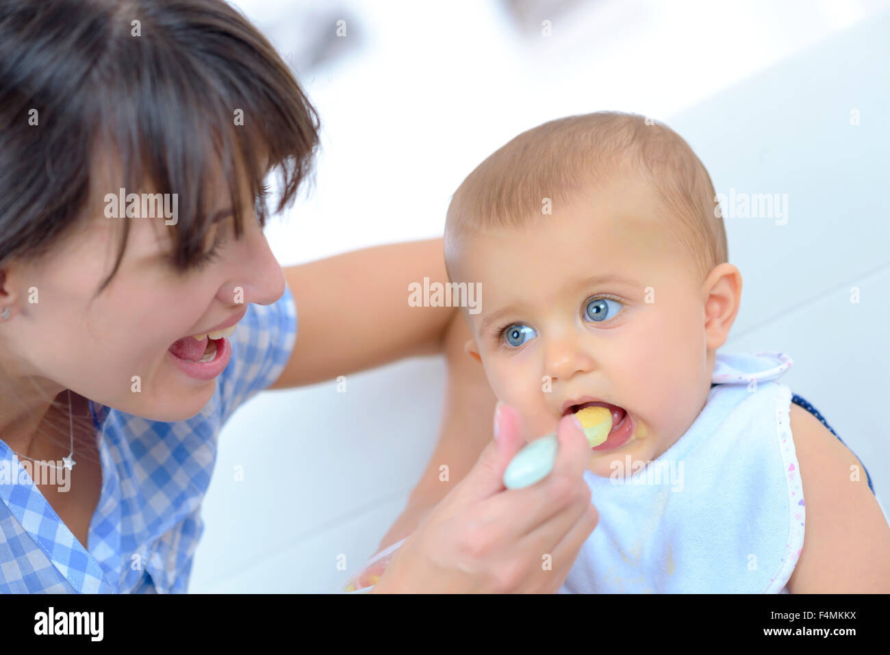 Feeding her baby boy Stock Photo - Alamy