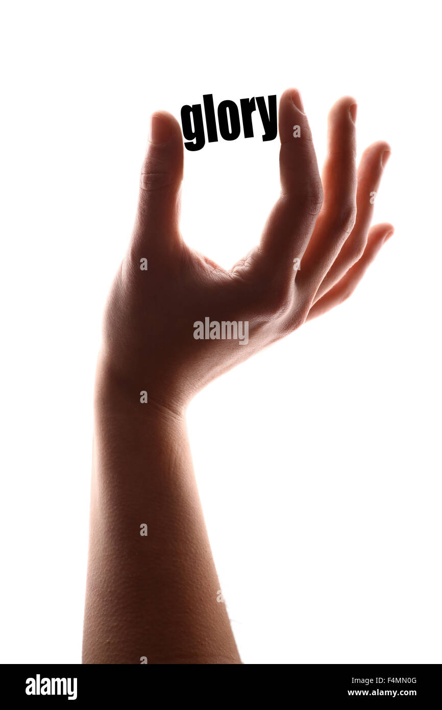 Color vertical shot of a of a hand squeezing the word "glory Stock ...