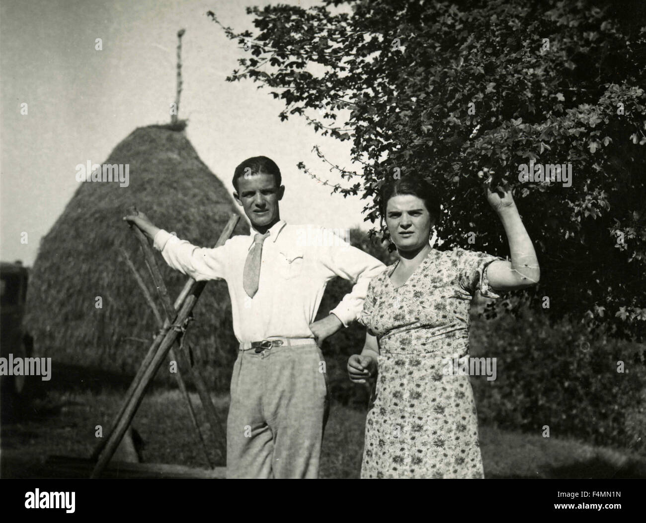 Couple with barn in the background, Denmark Stock Photo - Alamy