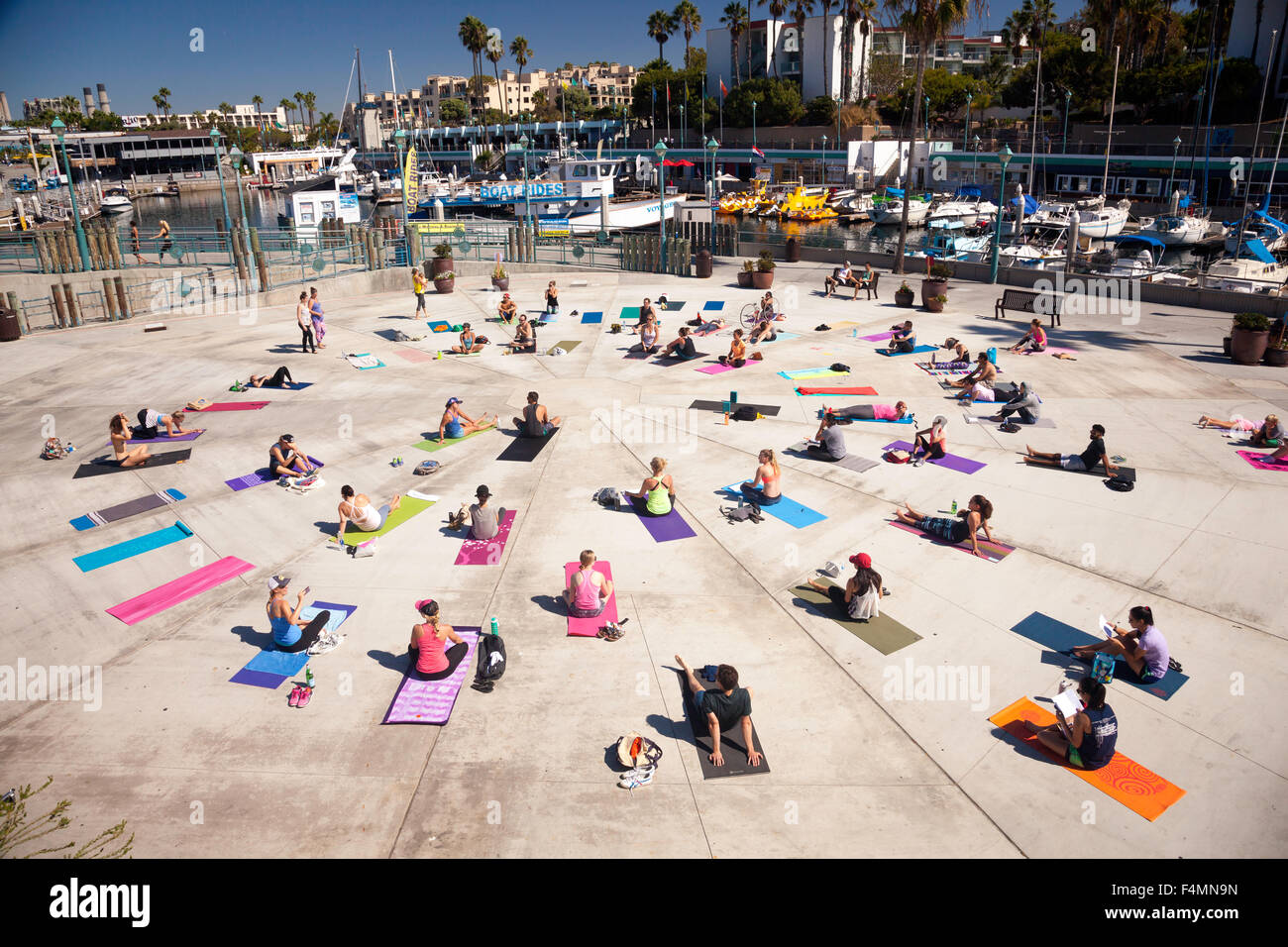 Group performing yoga exercises hi-res stock photography and images - Alamy