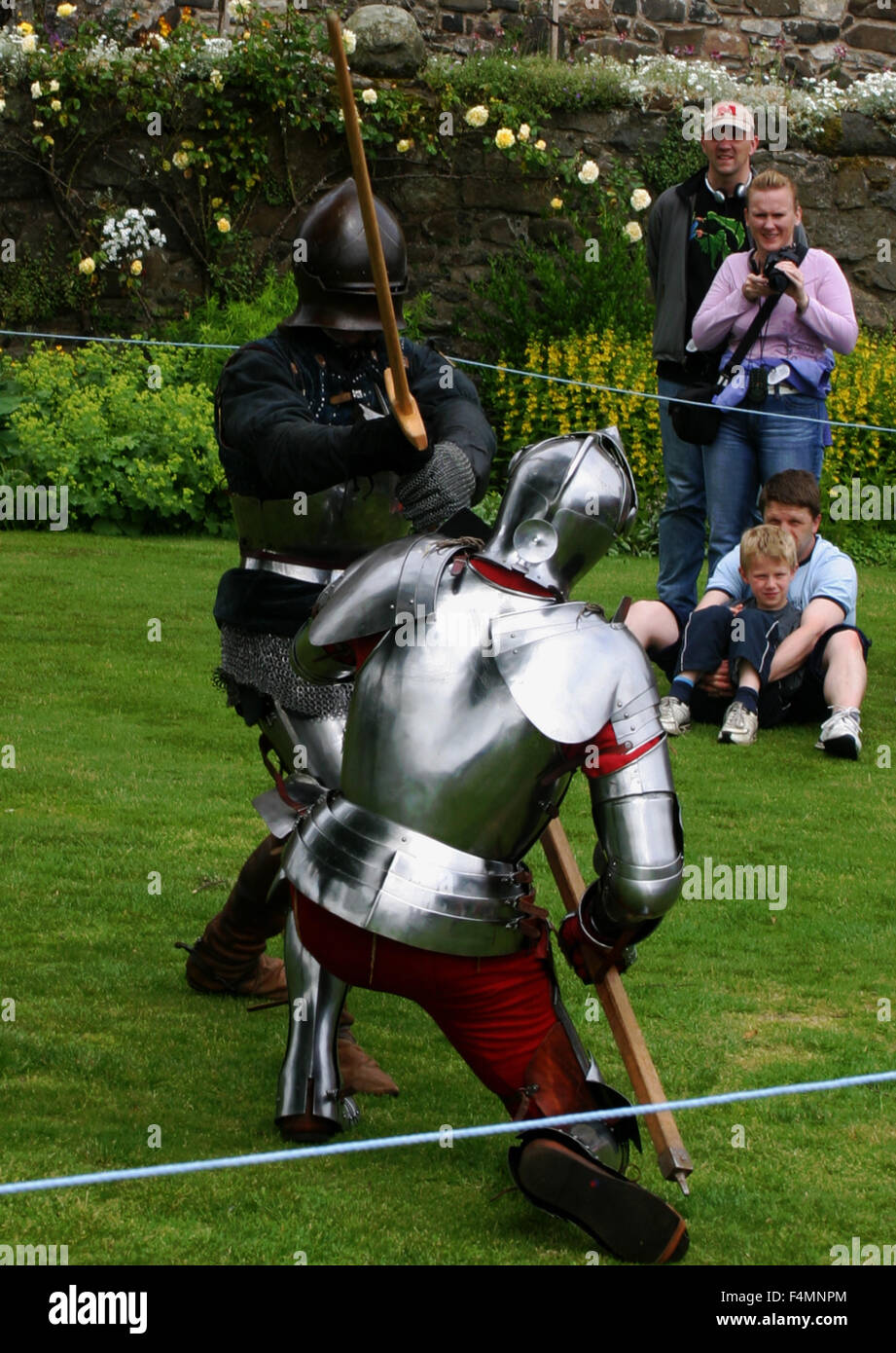Knight armour sword kneel hi-res stock photography and images - Alamy