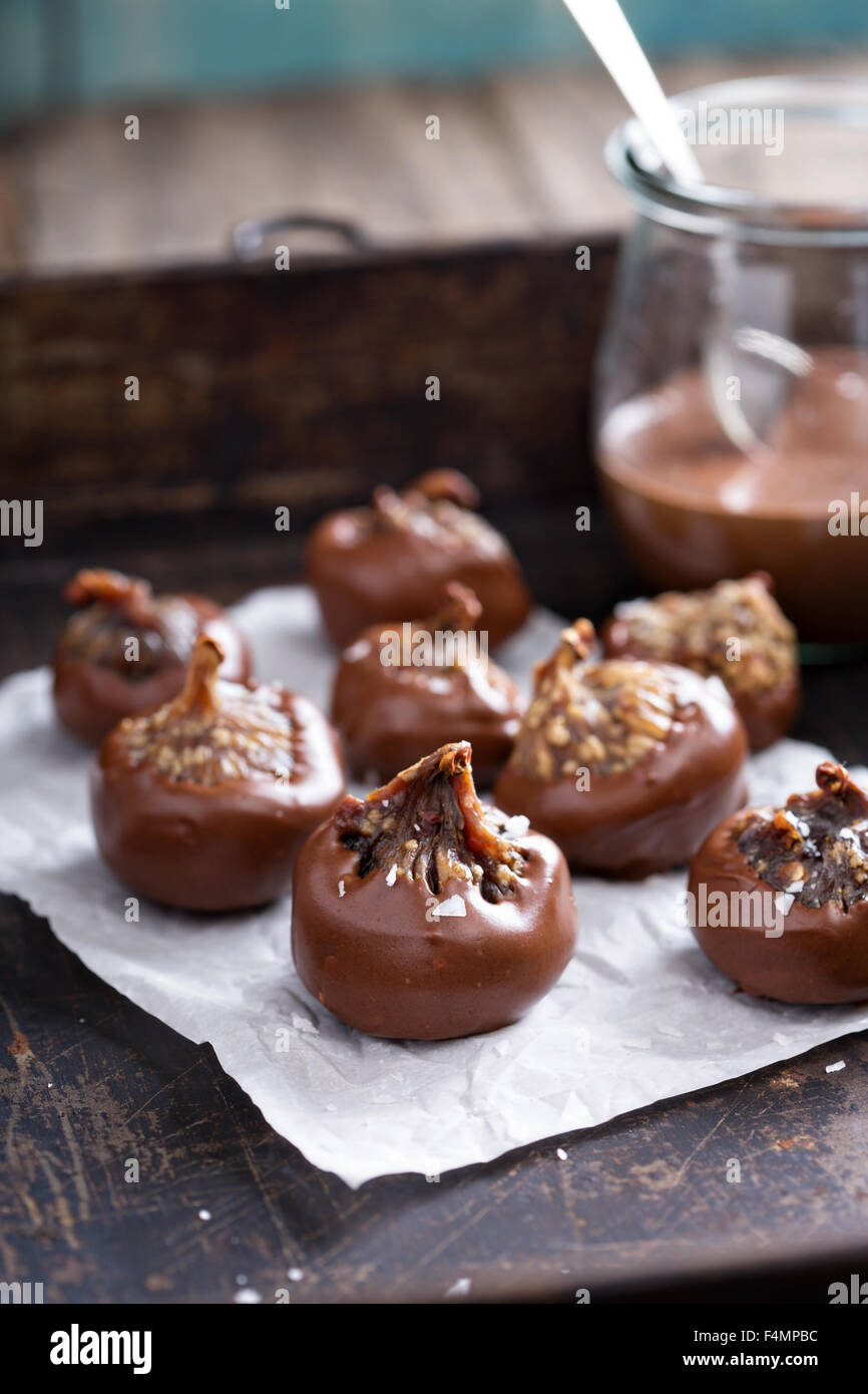 Healthy candy figs stuffed and coated with chocolate Stock Photo - Alamy