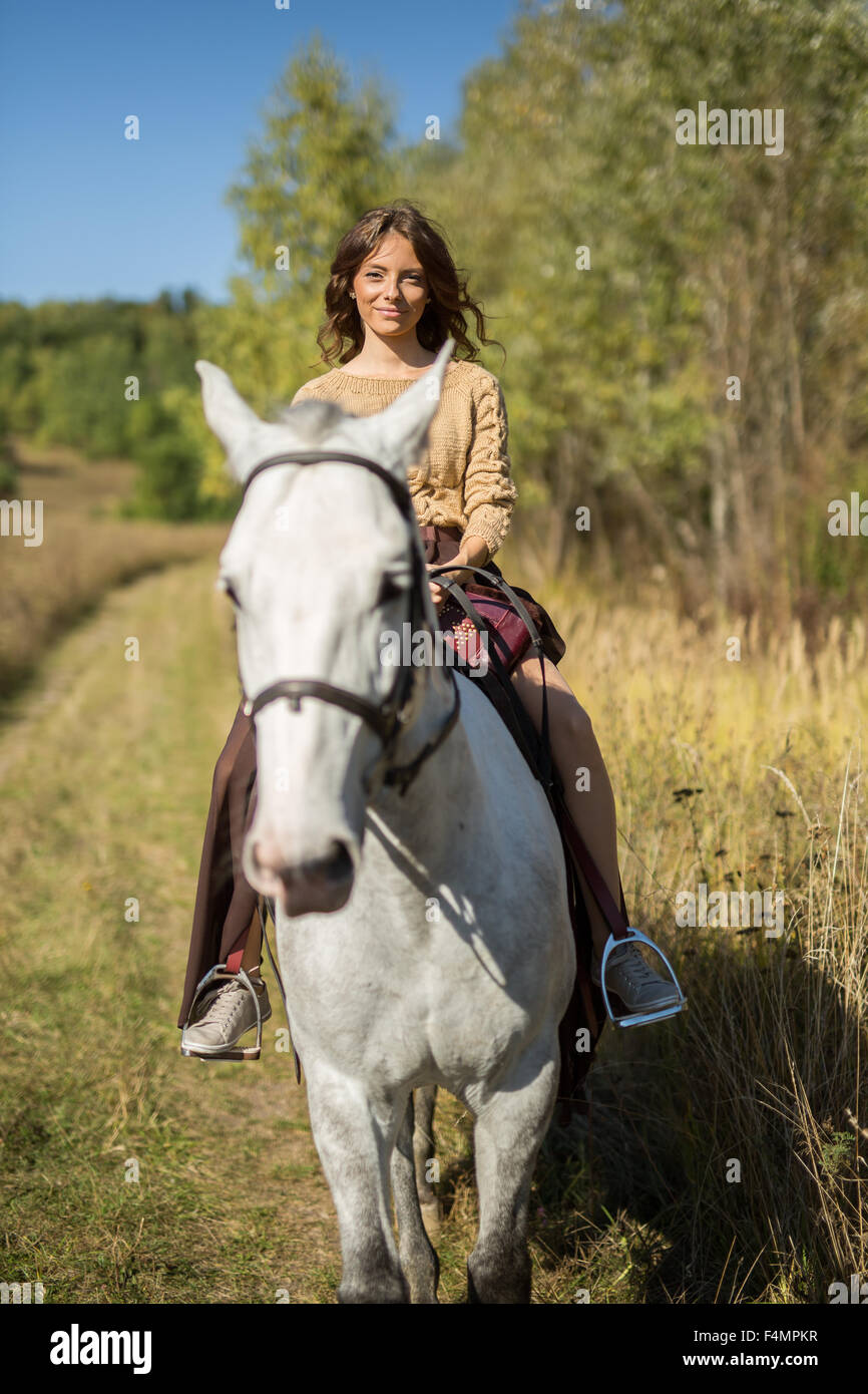 Beautiful brunette woman riding horse hi-res stock photography and ...