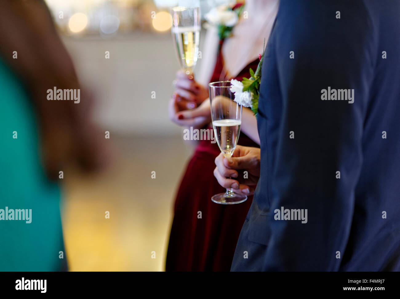 Wedding guests talking and holding champagne Stock Photo - Alamy
