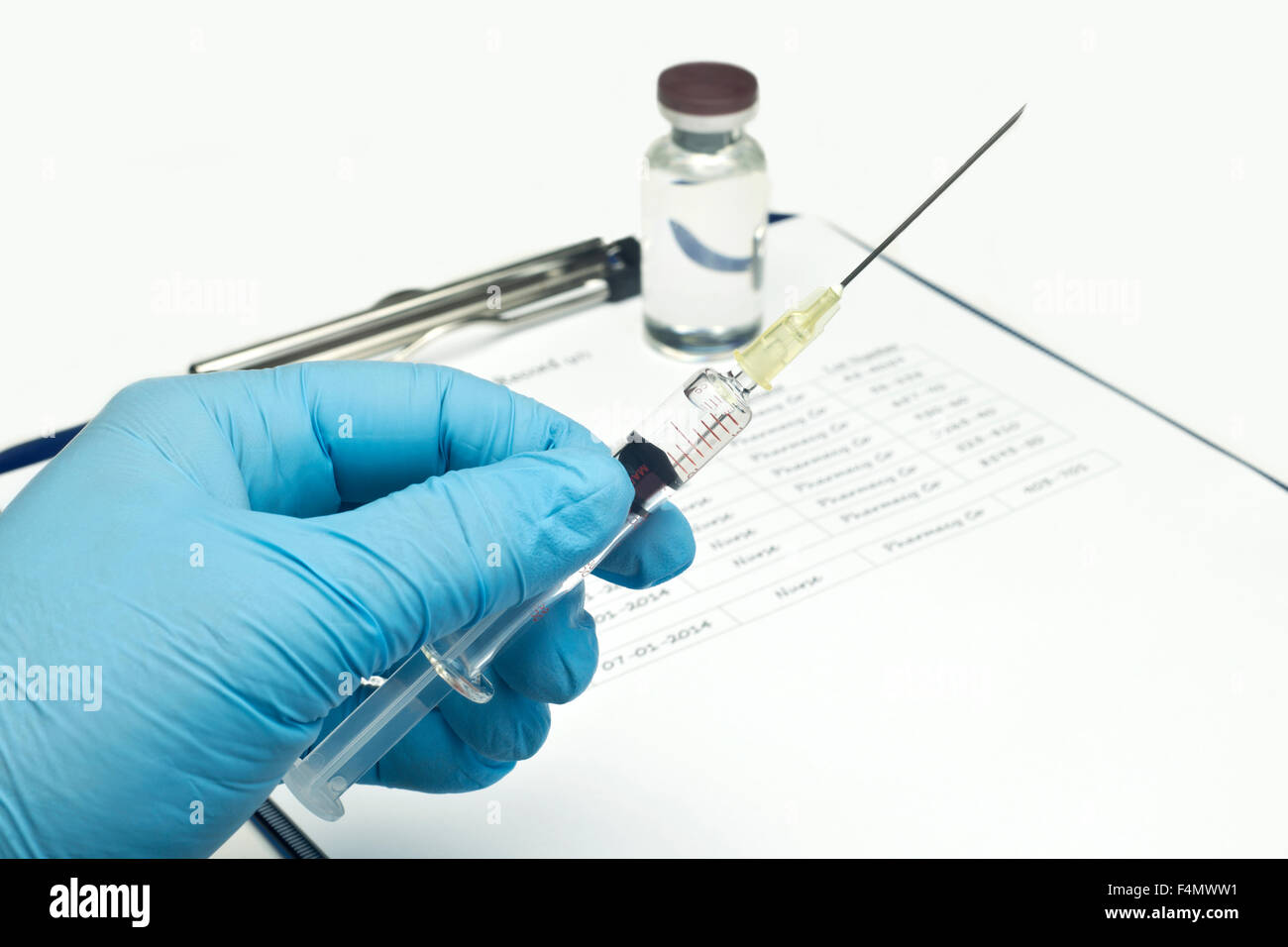 Nurse prepares syringe for vaccination injection with immunization ...