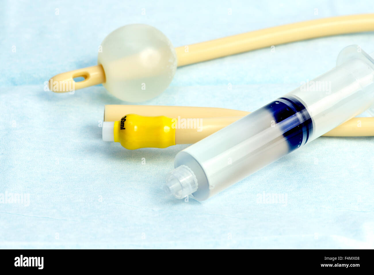 Urinary catheter with fill syringe on sterile drape Stock Photo - Alamy