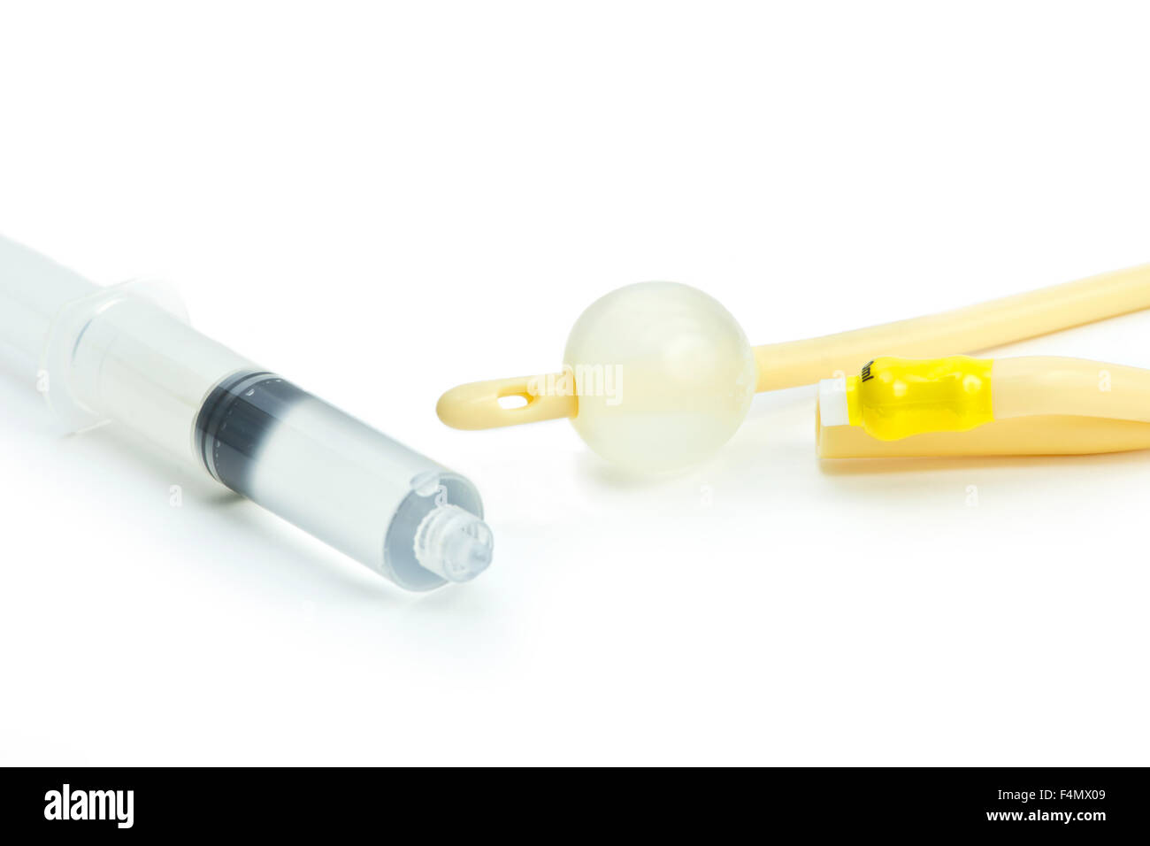 Urinary catheter with fill syringe on white background Stock Photo - Alamy