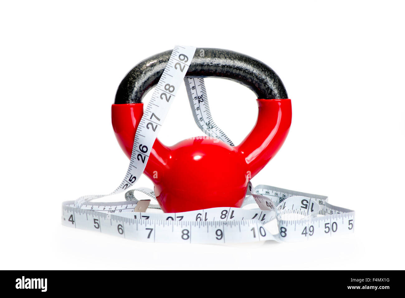 Red workout weight with tape measure Stock Photo - Alamy