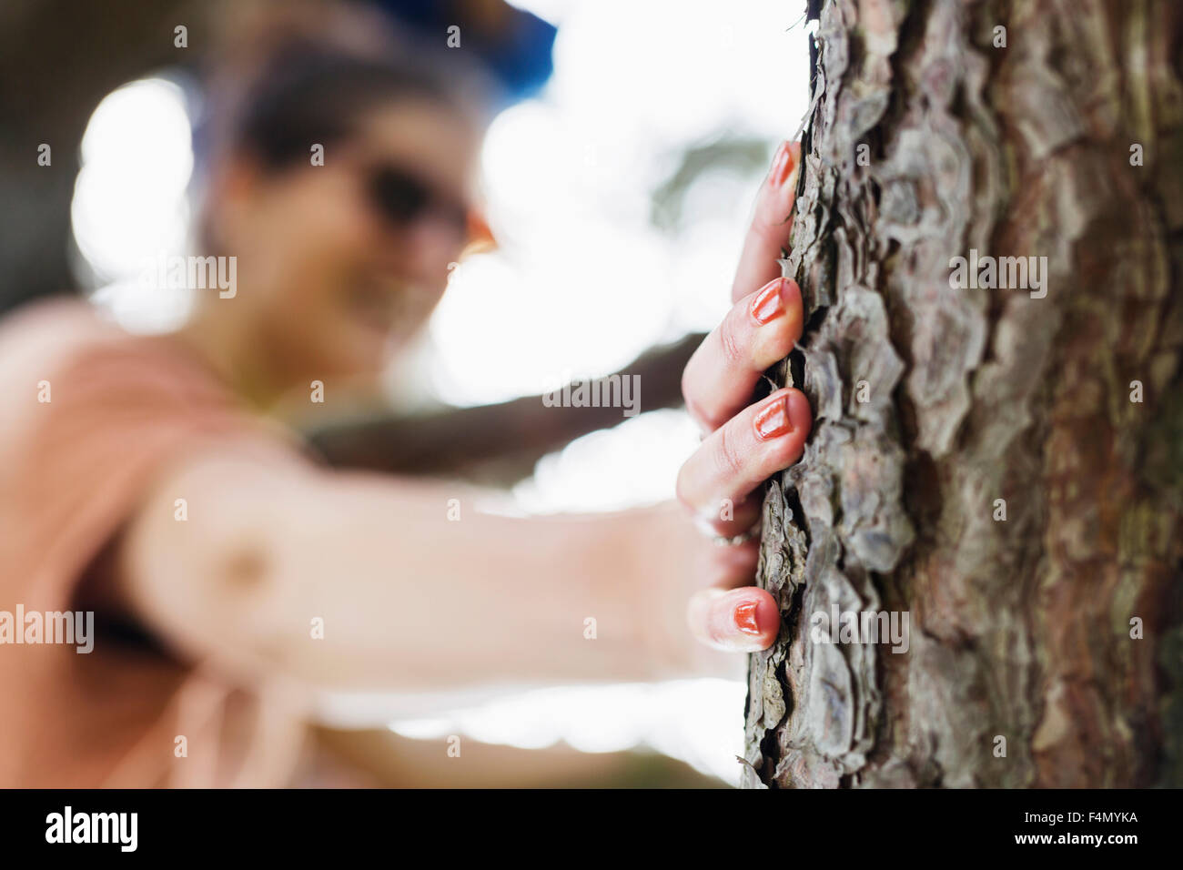 Close up woman climbing tree hi-res stock photography and images - Alamy