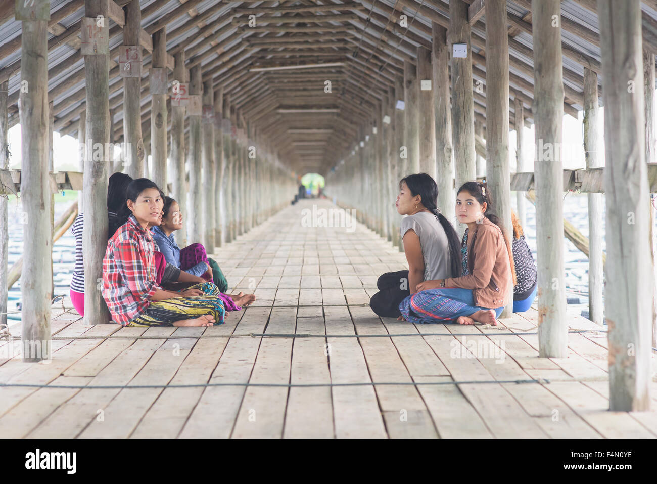 Women workers relaxe at a soft shell crab farm in Myeik, a township in ...