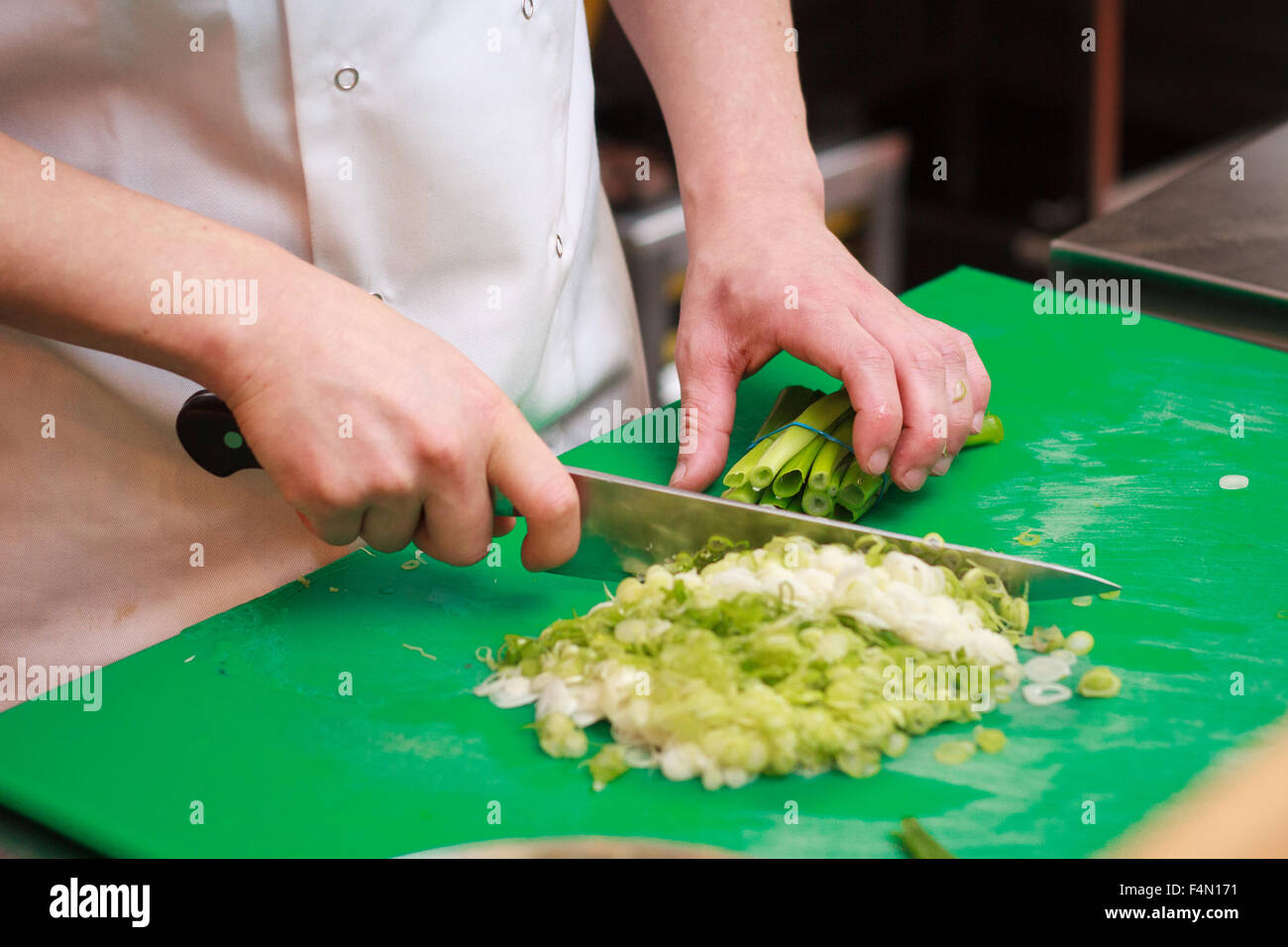 Chef Chopping Spring Onion at a Restaurant Stock Photo - Alamy