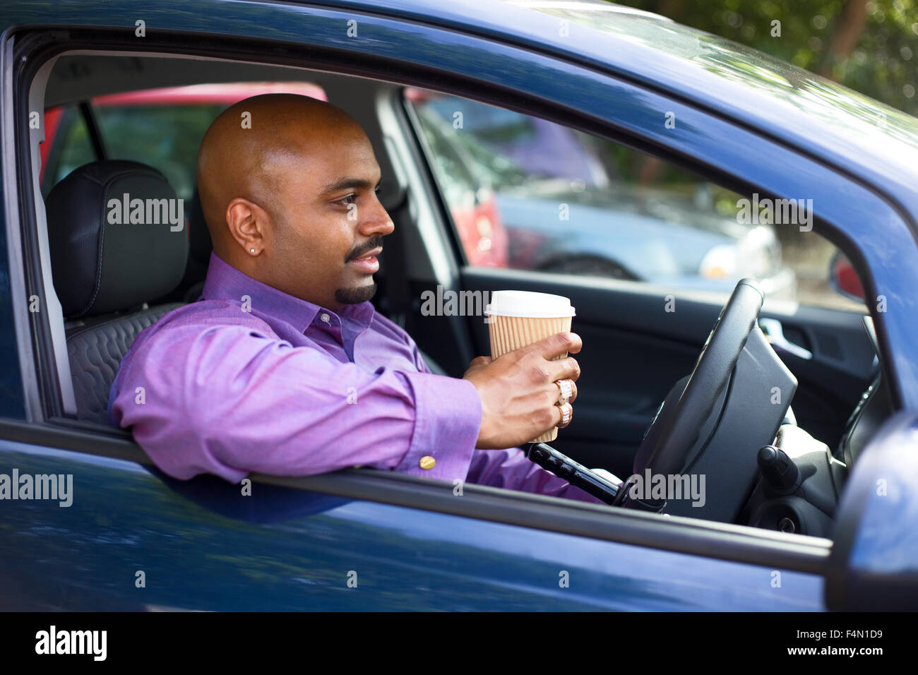 Man drinking coffee driving car hi-res stock photography and images - Alamy
