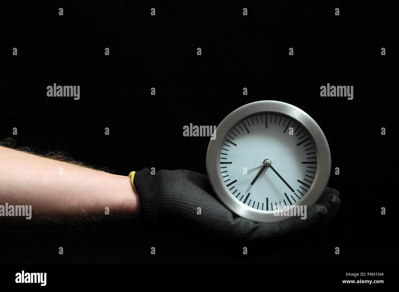 Clock And an Hand Stock Photo - Alamy