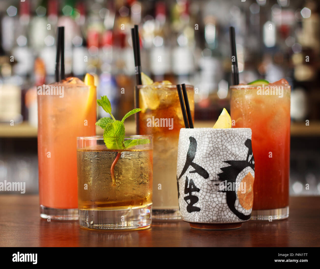 Row of different cocktails on a bar top Stock Photo - Alamy