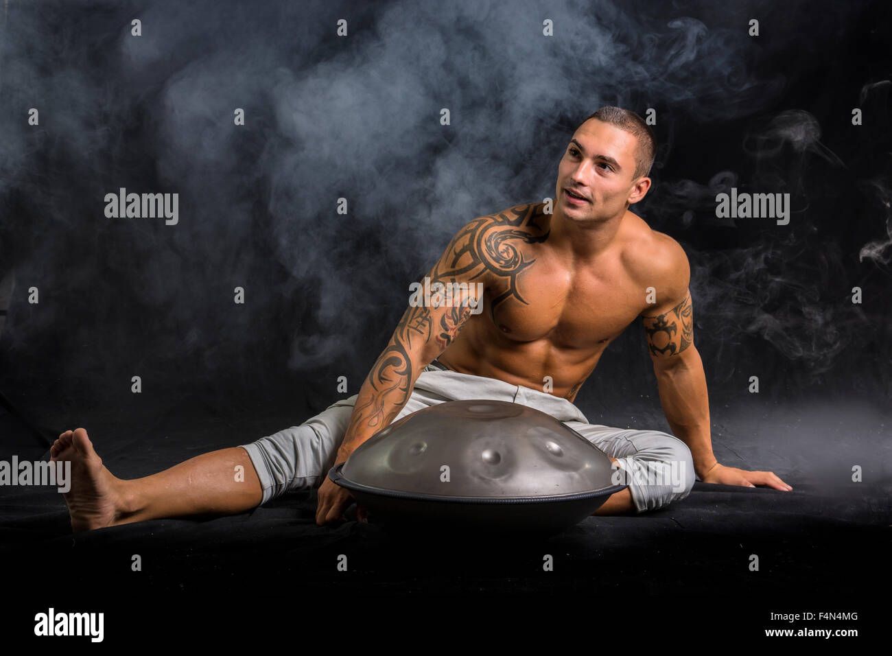 Exotic Male Drummer Drumming with Hands on Steel Pan Drums, While ...