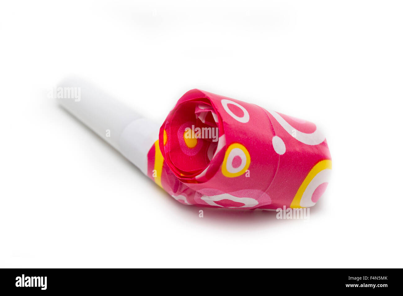 Red Party blower with dots isolated on white background Stock Photo - Alamy