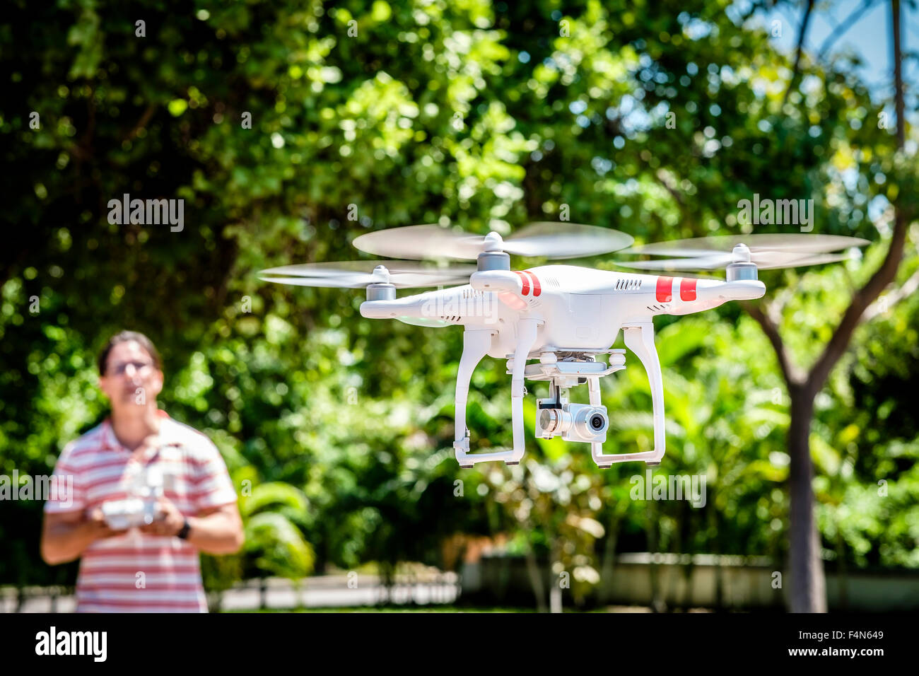 Man flying drone Stock Photo - Alamy