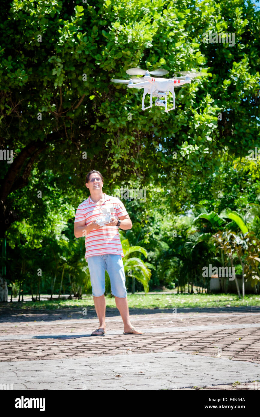 Man flying drone Stock Photo - Alamy