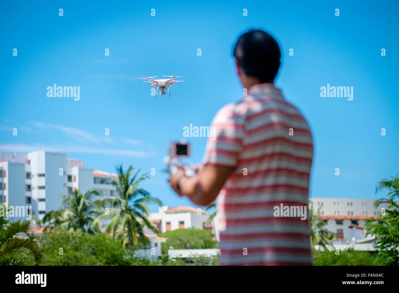 Man flying drone Stock Photo - Alamy