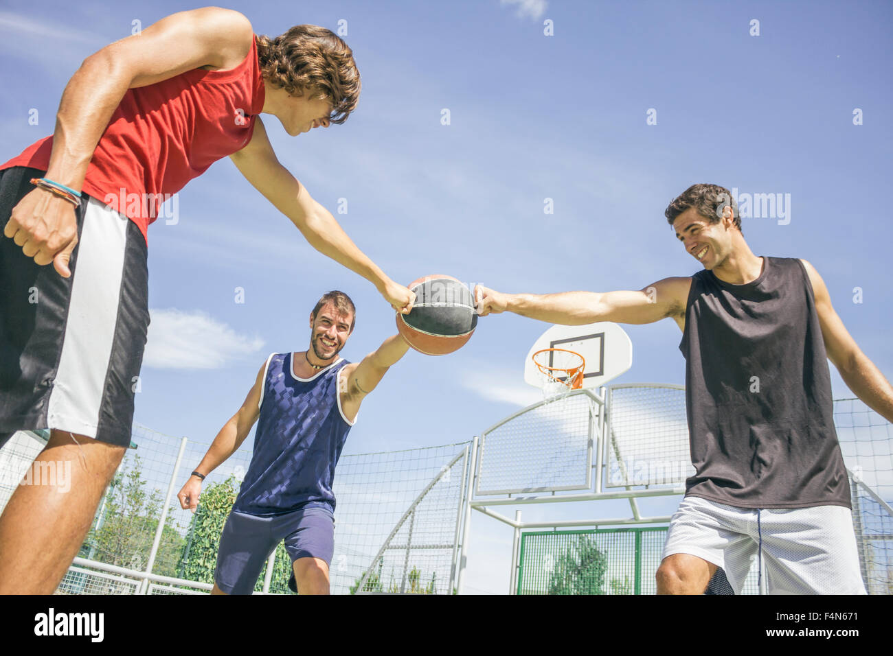 Three young men playing basketball Stock Photo - Alamy Three young men playing basketball Stock Photo - Alamy