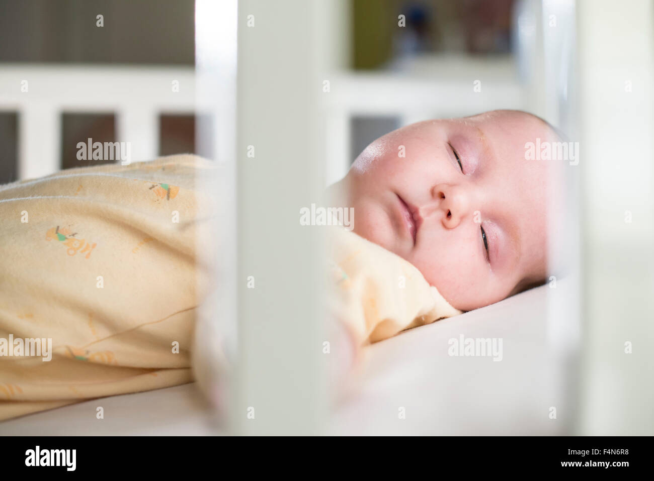 Baby girl sleeping cot hi-res stock photography and images - Alamy