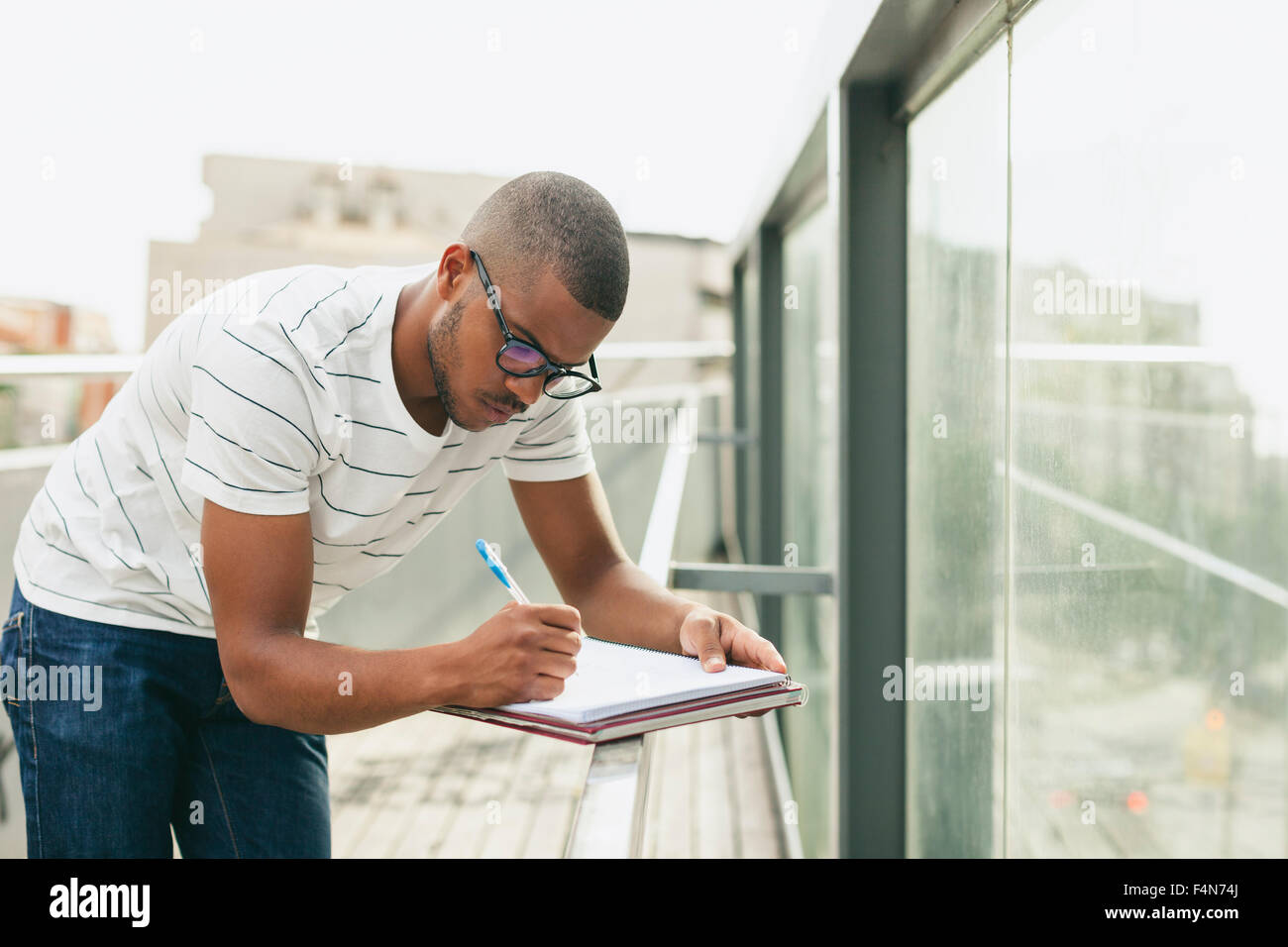 Young Afro-american man studying language Stock Photo - Alamy