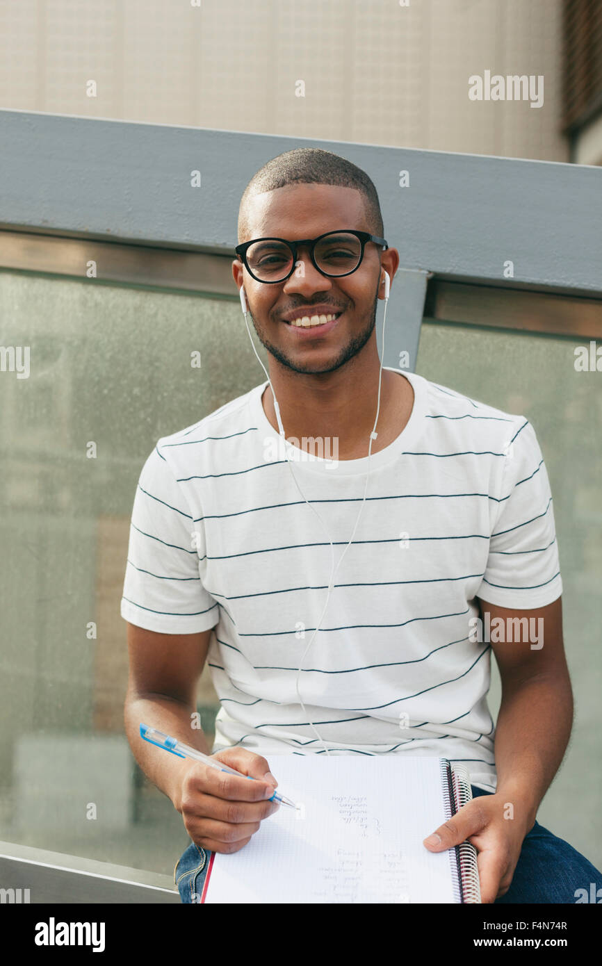 Young Afro-american man studying language Stock Photo - Alamy