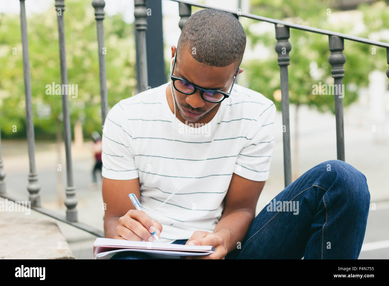 Young Afro-american man studying language Stock Photo - Alamy