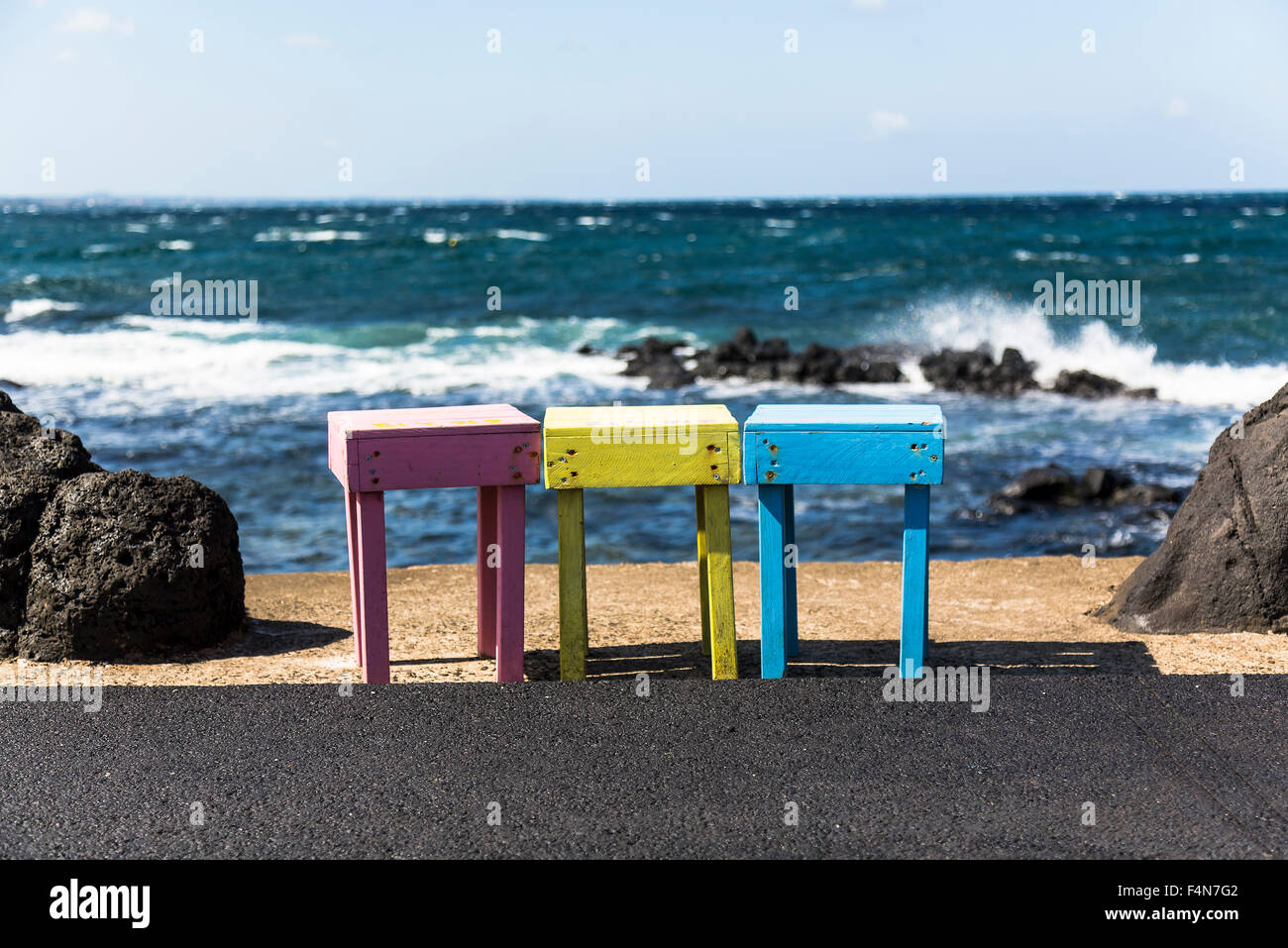 Three Colorful Benches at the Beach Stock Photo - Alamy