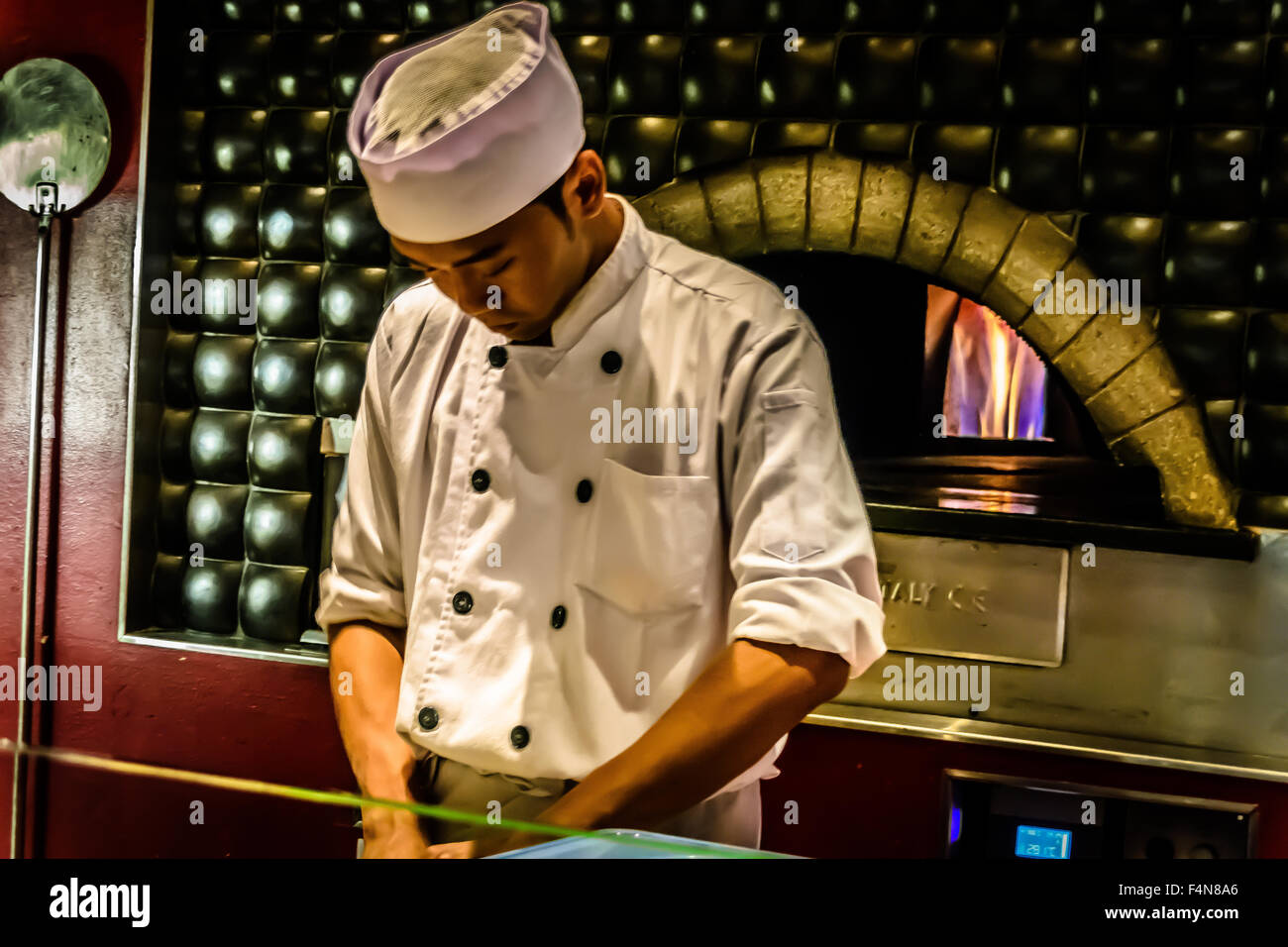 Chefs working in italian restaurant kitchen Stock Photo - Alamy