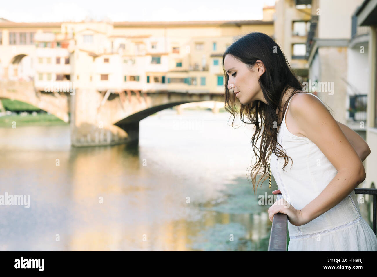 Italy, Florence, woman in front of Ponte Vecchio Stock Photo - Alamy