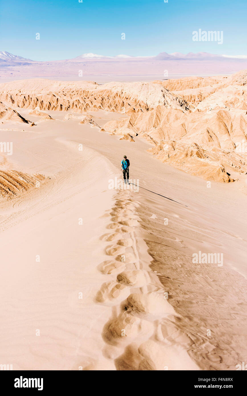 Chile, Atacama Desert, man climbing a dune Stock Photo - Alamy