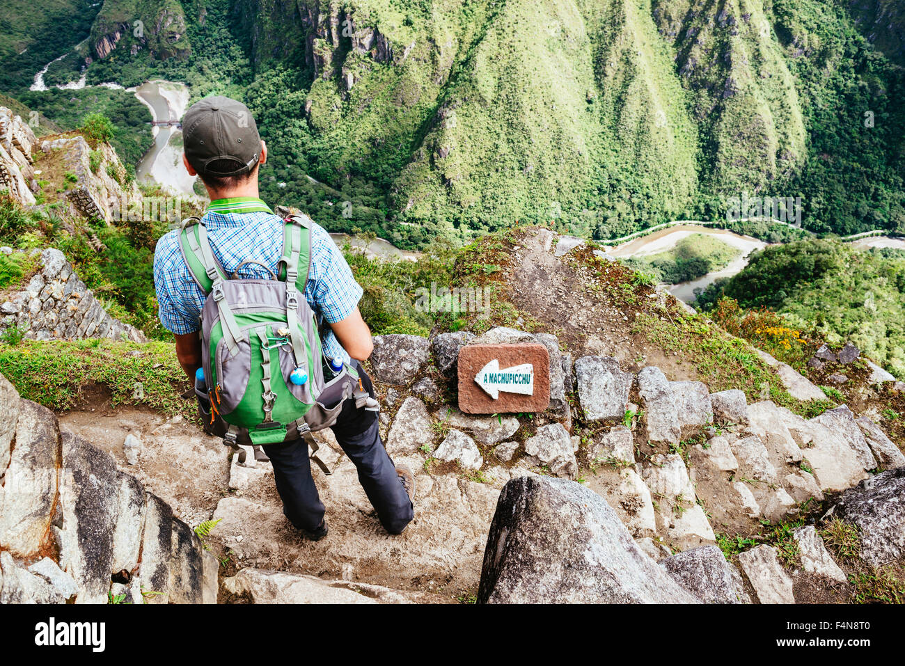 Peru, Machu Picchu region, traveler lokking at Machu Picchu citadel ...