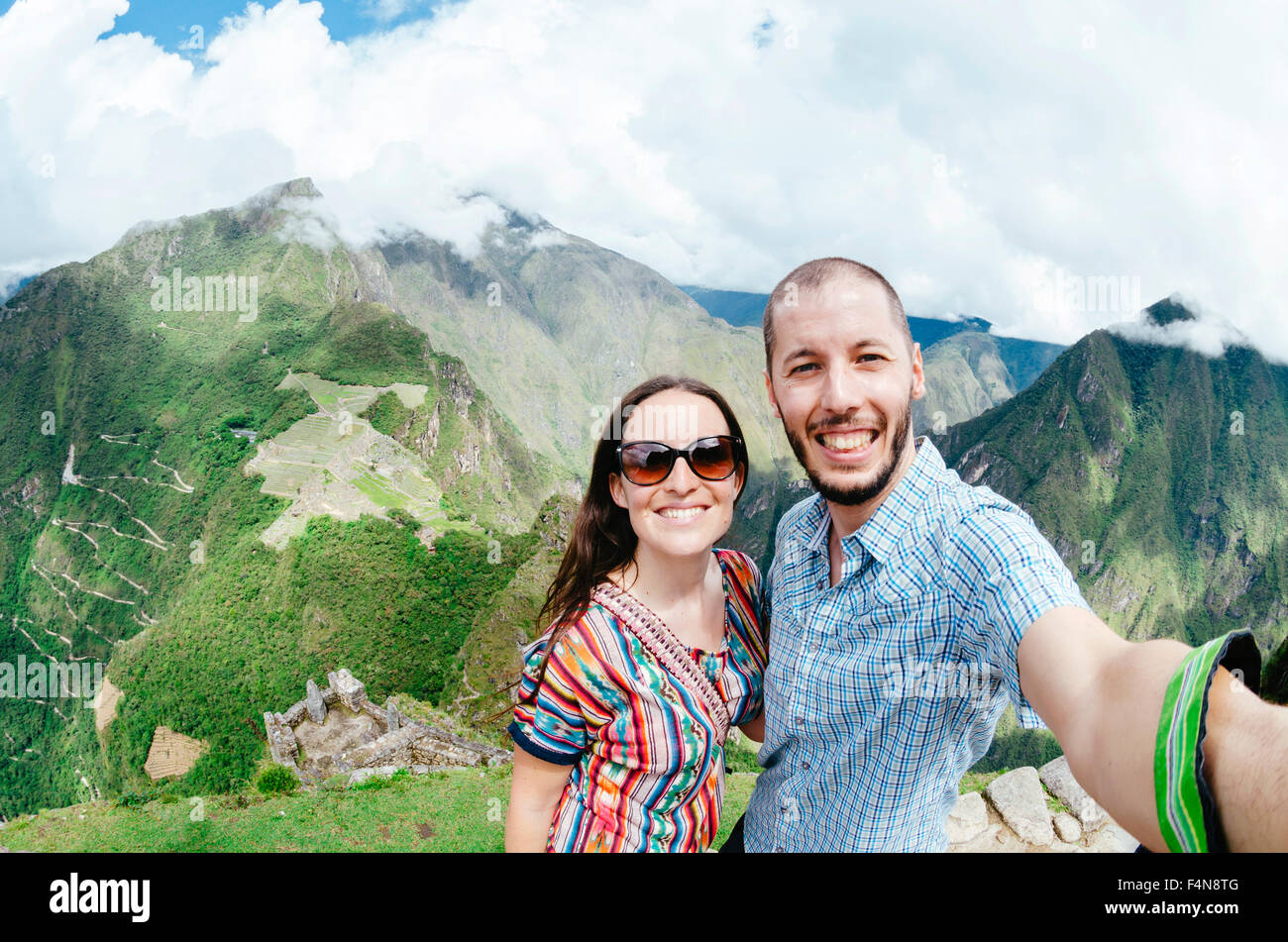 Peru, Machu Picchu region, Travelling couple taking selfie Stock Photo ...
