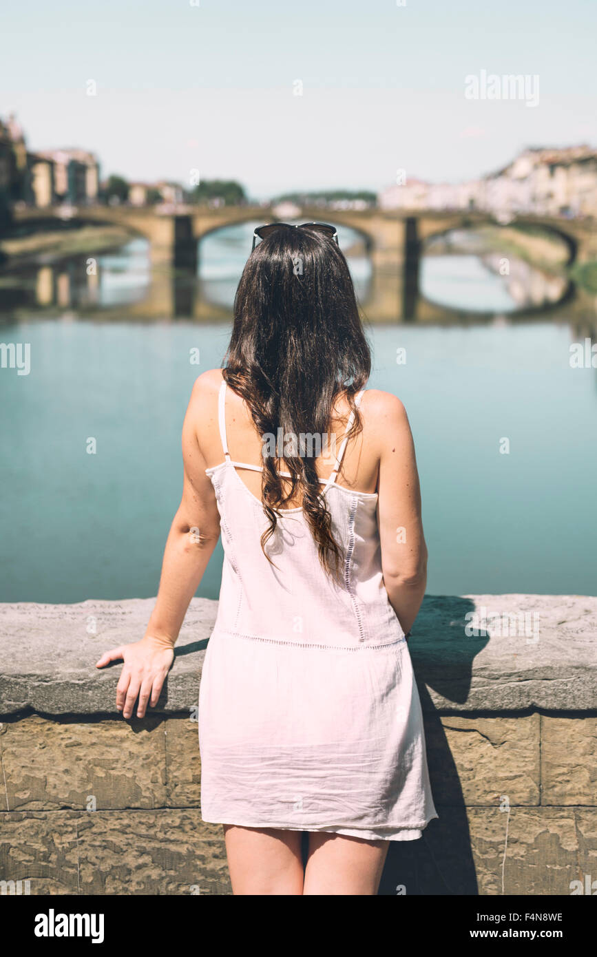 Italy, Florence, woman looking from Ponte Vecchio Stock Photo - Alamy