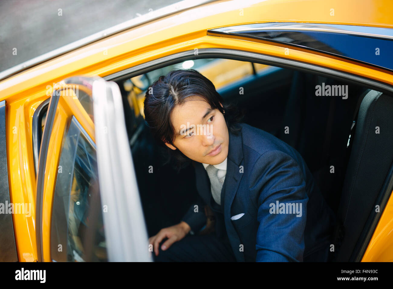 USA, New York City, businessman entering a taxi Stock Photo - Alamy