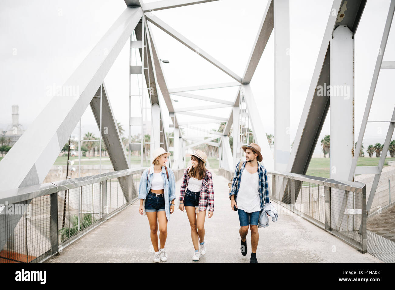 Three friends walking bridge hi-res stock photography and images - Alamy