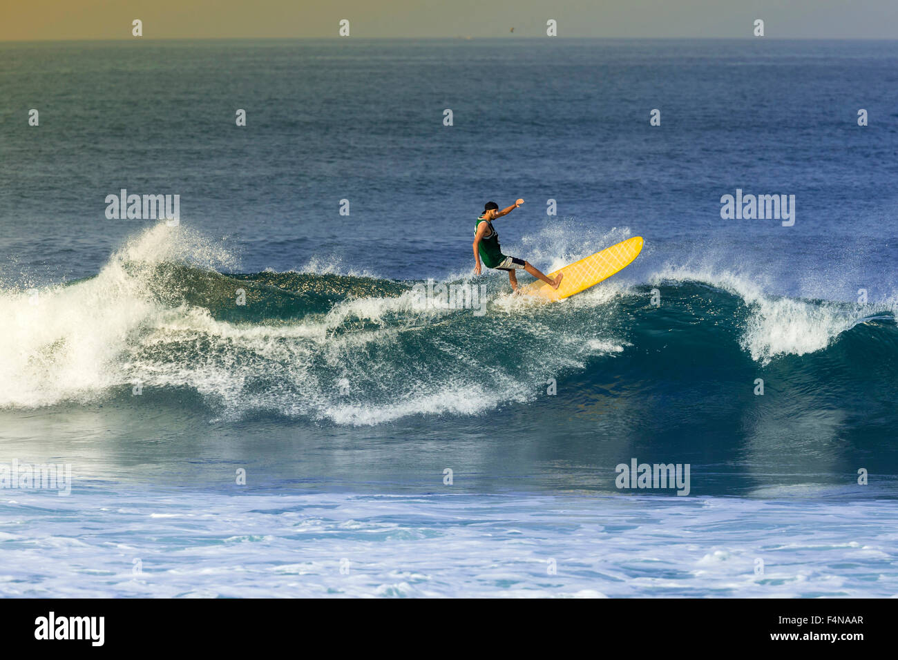 Indonesia, Bali, man surfing a wave Stock Photo - Alamy