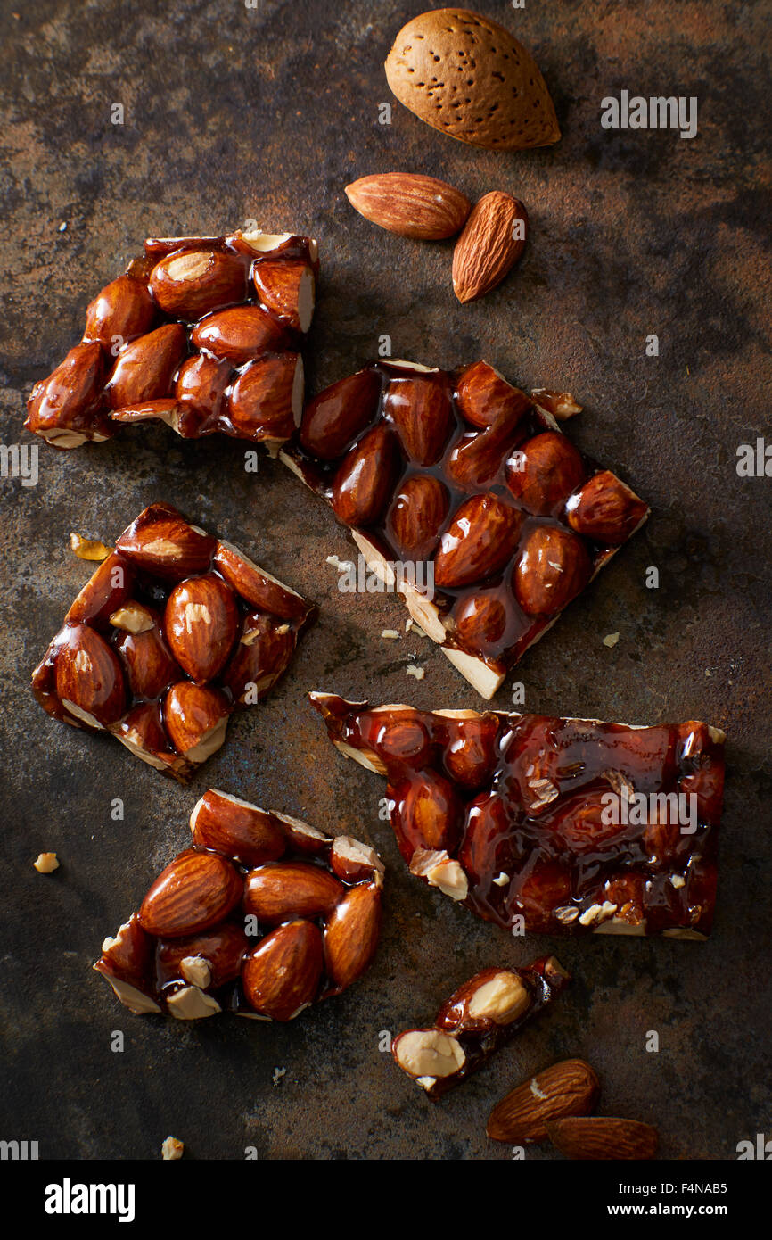 Homemade almond brittle and almonds Stock Photo - Alamy